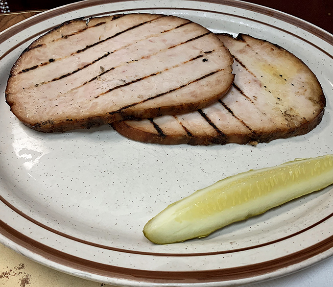 Smoked turkey slices with perfect grill marks prove that poultry deserves just as much respect in the barbecue world.