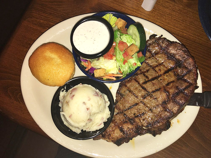 This steak has more perfect grill marks than a geometry textbook, paired with sides that aren't just phoning it in.