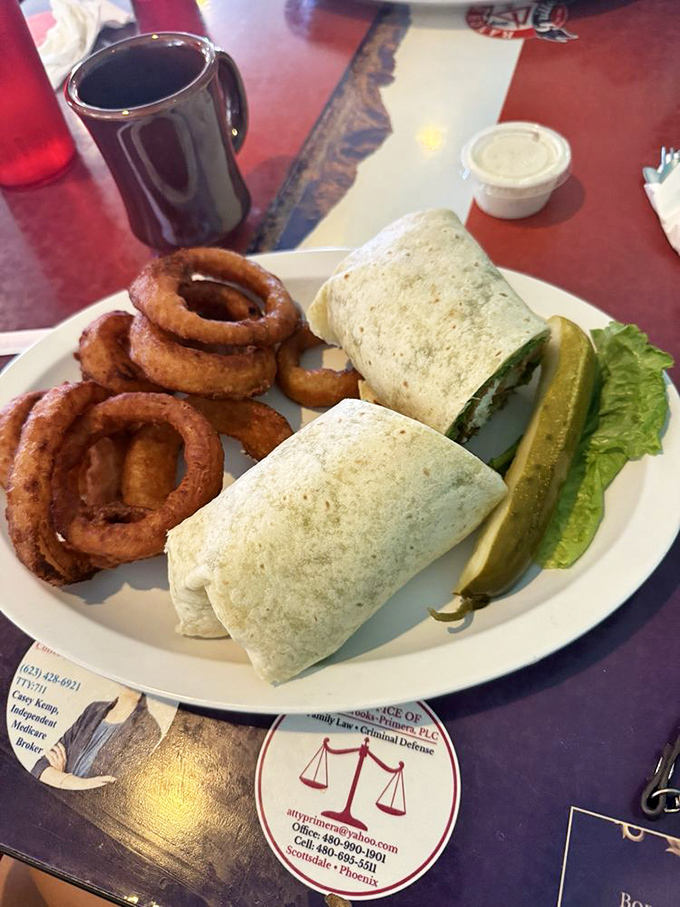 A wrap that's dressed better than most people at the mall, with those onion rings playing the perfect supporting role.