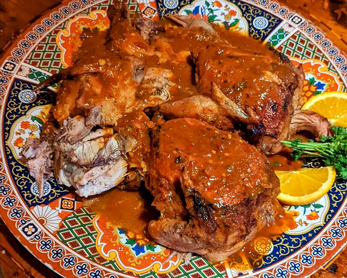 A symphony of tomatoes, peppers, and secret spices creates a sauce that hugs every inch of this chicken&mdash;proof that sometimes the messiest dishes taste the most magnificent.