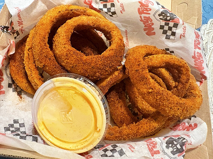 Onion rings with attitude&mdash;crispy, golden, and unapologetically indulgent. Diet culture's perfect nemesis served in a checkered basket.