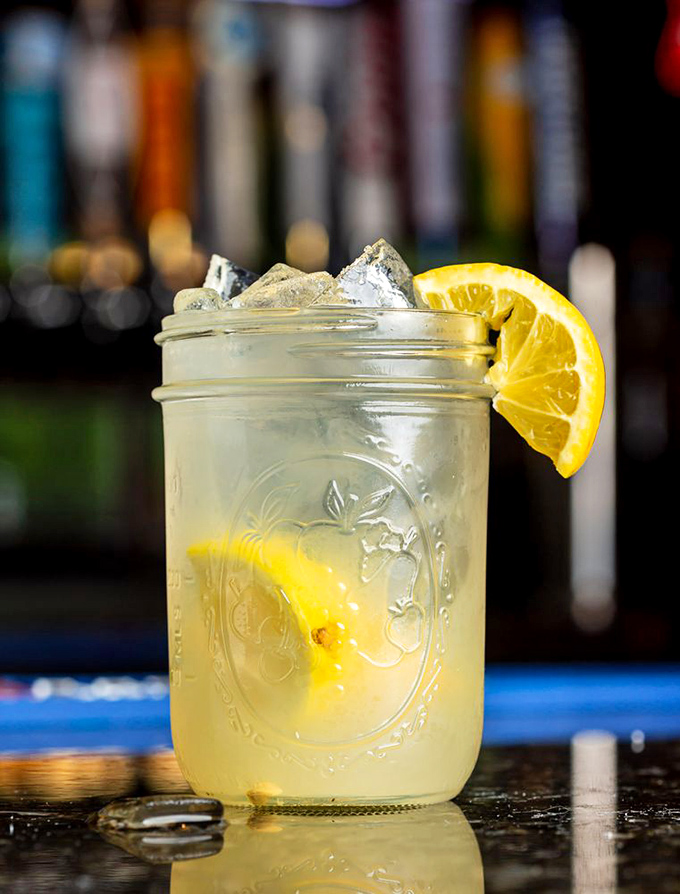 Mason jar lemonade with that perfect sweet-tart balance &ndash; summer in a glass, complete with a slice of sunshine on the rim.