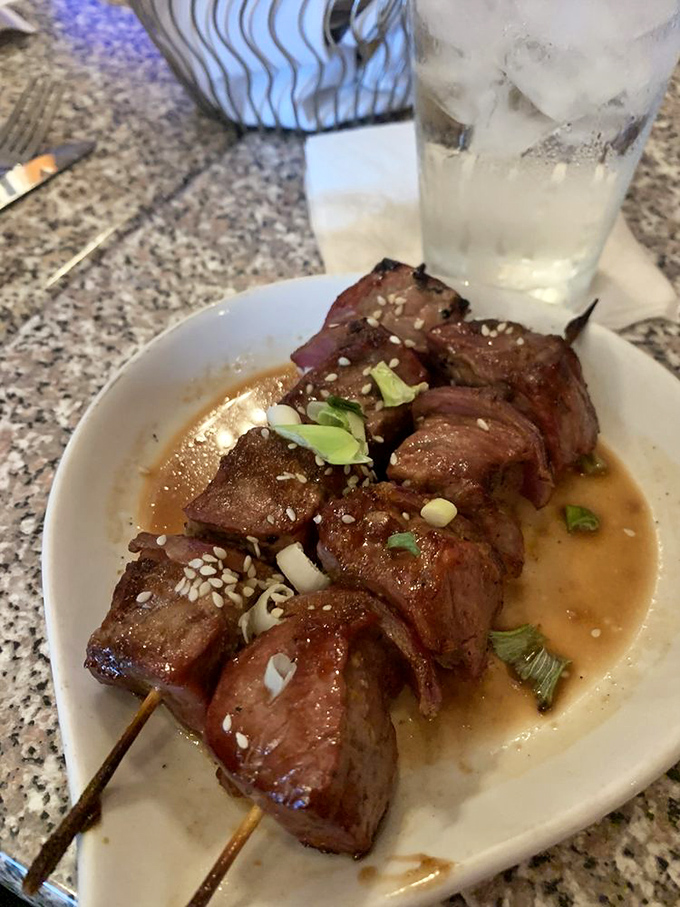 These steak skewers, glistening with savory sauce and topped with sesame seeds, prove that sometimes the best bites come on a stick.