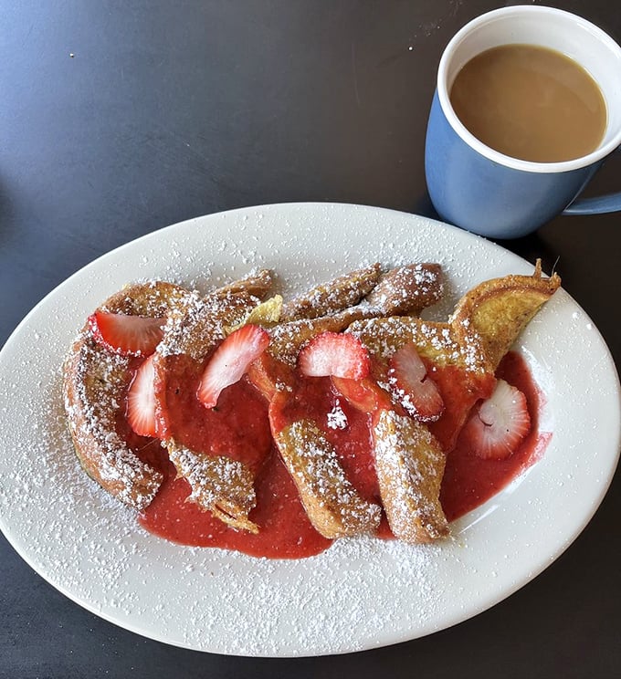 French toast that looks like it's ready for its close-up on a cooking show. Those strawberries aren't just a garnish&mdash;they're co-stars in this breakfast drama.