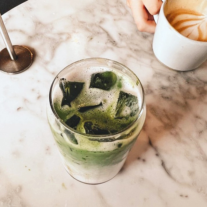 Matcha meets marble in this Instagram-worthy beverage. The swirling green and white isn't just pretty &ndash; it's a refreshing flavor adventure waiting to happen.