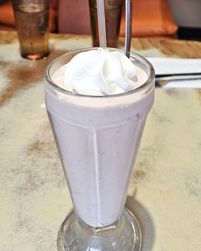 This strawberry milkshake stands tall and proud, thick enough to require actual effort and absolutely worth every sip.