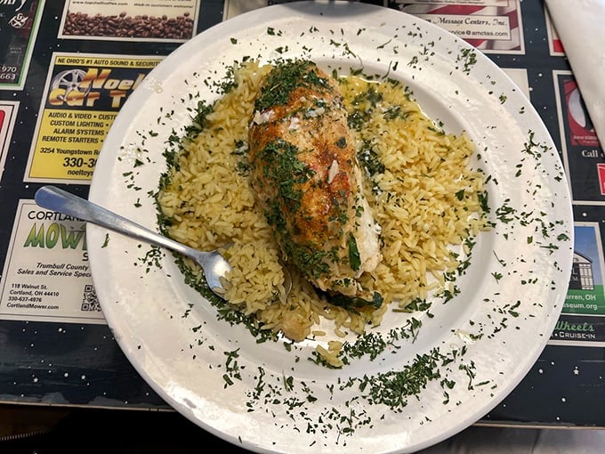 Stuffed baked cod nestled on a bed of rice &ndash; seafood comfort that would make coastal restaurants jealous of this Ohio gem.