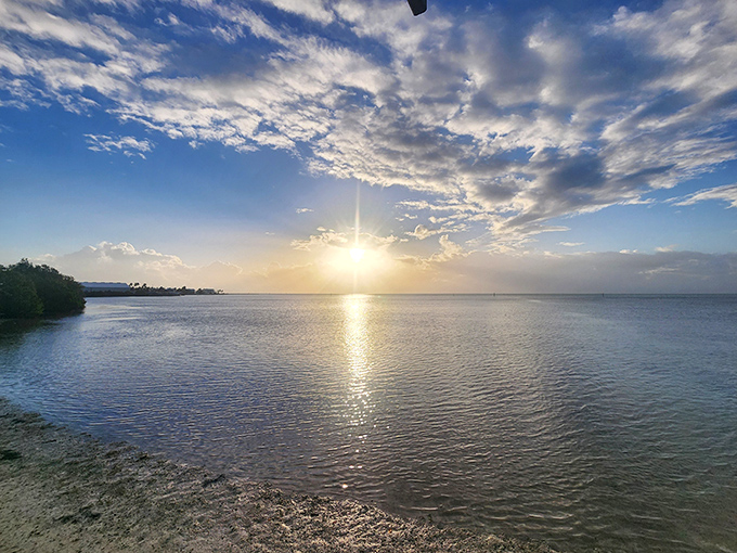 Sunrise at Anne's Beach transforms ordinary water into liquid gold&mdash;the kind of wealth you can't deposit but never forget.