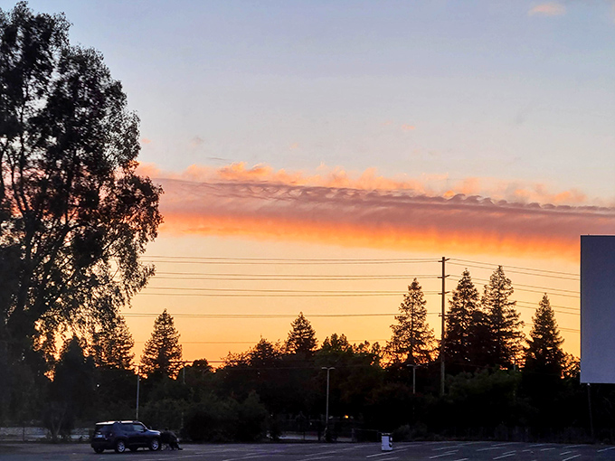 Mother Nature delivers her own spectacular show as sunset paints the Sacramento sky, warming up the audience before the projectors roll.