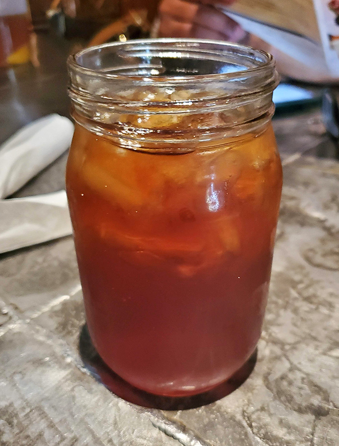 Sweet tea served in a mason jar &ndash; the unofficial champagne of the South and the perfect companion to spicy soul food.