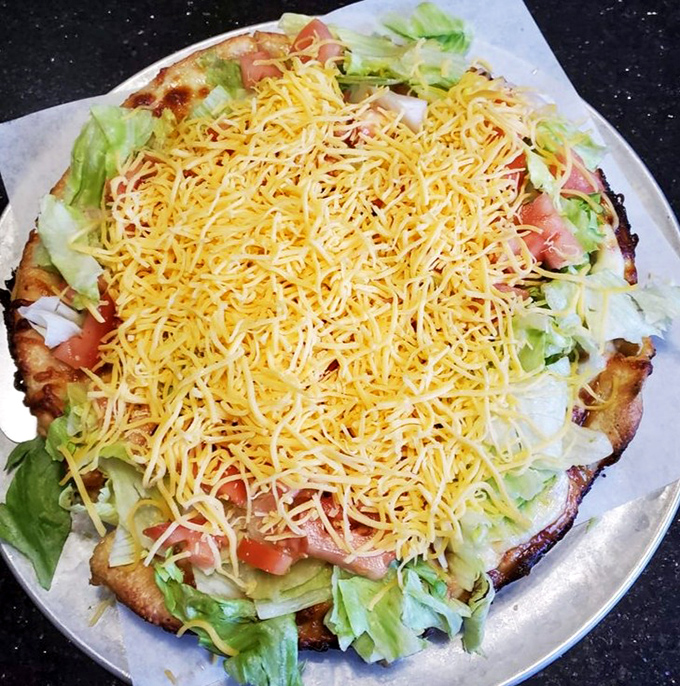 A taco pizza that brilliantly solves the age-old dilemma of "Mexican or Italian tonight?" The answer is gloriously "both."