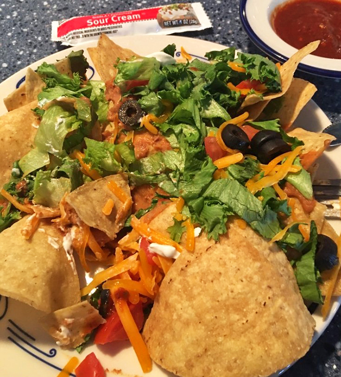 The taco salad: where Southwestern flavors meet space-age presentation. Those tortilla chips stand like communication towers receiving delicious signals.
