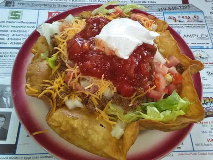This taco salad isn't trying to be authentic Mexican cuisine&mdash;it's pure Midwestern interpretation, where "more is more" is the only acceptable philosophy.