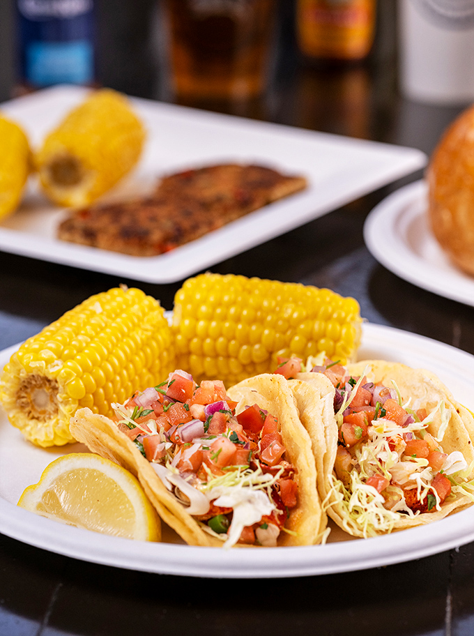 Fish tacos that tell the true California story – where Mexican tradition meets Pacific bounty, with corn on the cob playing supporting actor.
