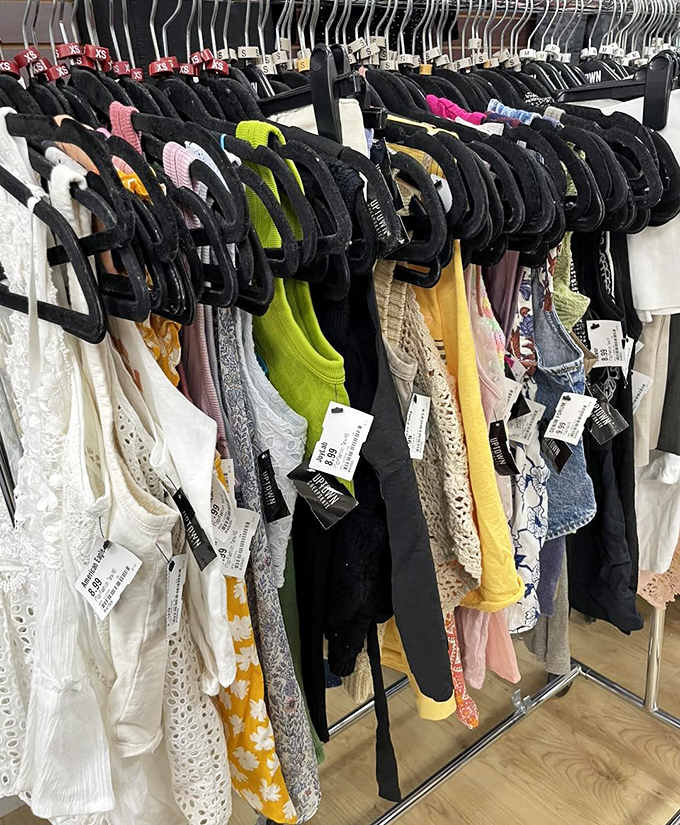 Tank tops and summer essentials lined up like soldiers ready for warm-weather battle. Fashion's front line at fraction of the cost.