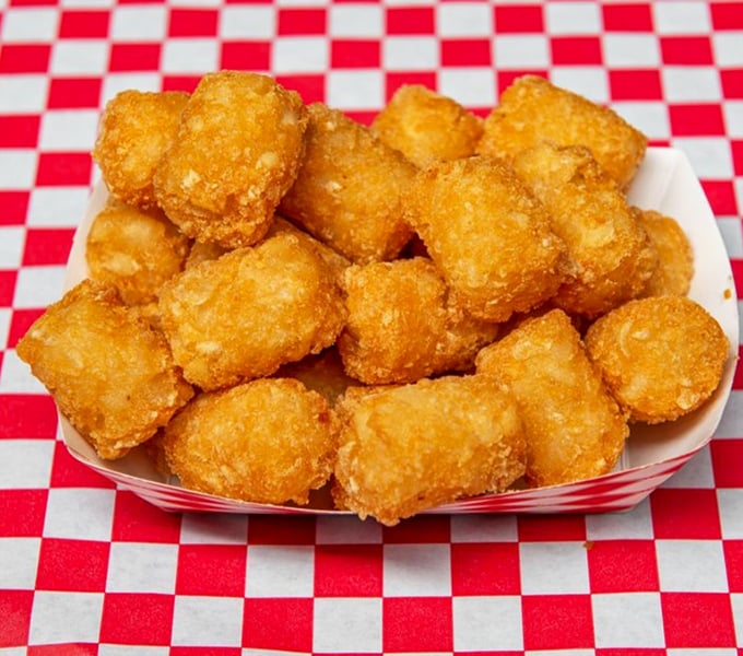 Golden tater tots that crunch like childhood memories&mdash;each one a perfect nugget of potato joy that makes you wonder why you ever grew up.