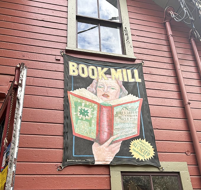 The Montague Bookmill sign promises literary adventures in a place you allegedly can't find but somehow everyone does anyway.