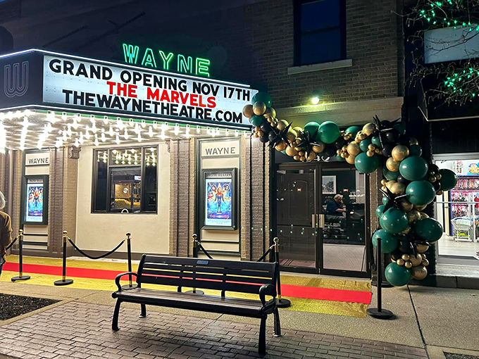 The Wayne Theatre's marquee lights up downtown nights with the kind of nostalgic glow that streaming services simply cannot replicate.