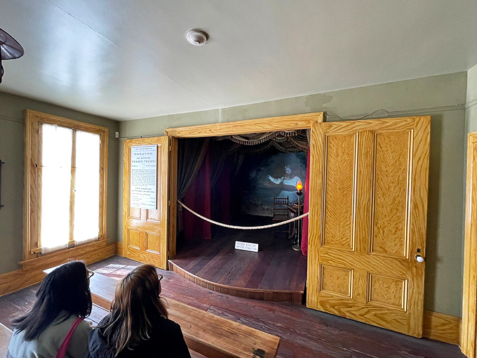 A tiny theater stage where entertainers once performed&mdash;now the spirits provide their own dramatic presentations nightly.