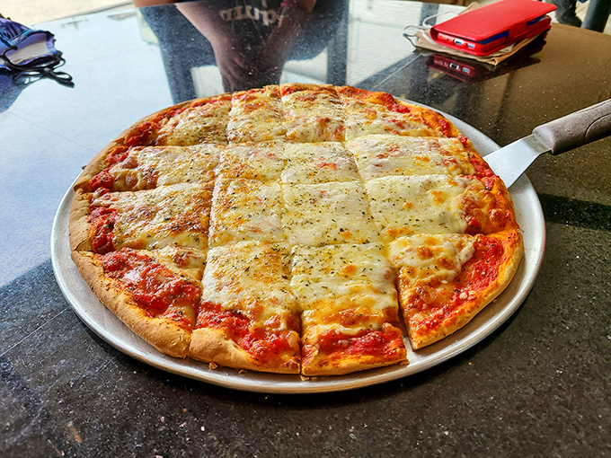 Even their thin crust pizza refuses to be ordinary &ndash; crisp, evenly cut squares of cheese-covered perfection that would make any New Yorker question their loyalty.