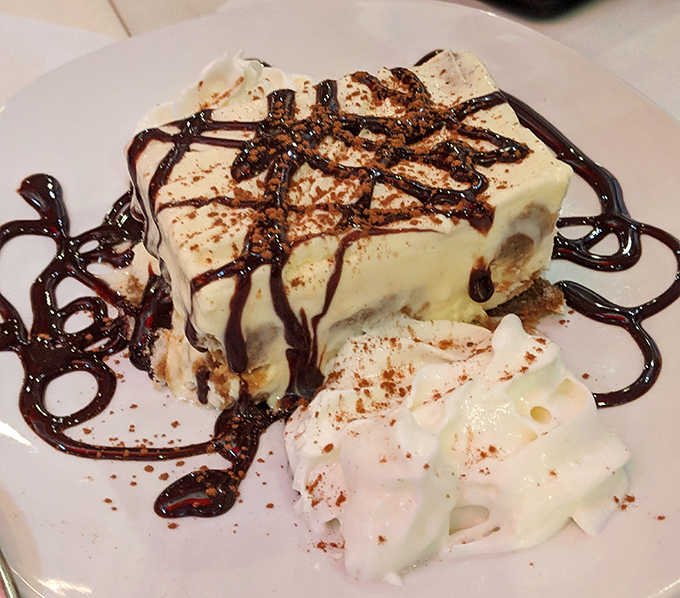 Even dessert gets the Ethiopian treatment at Demera. This tiramisu with chocolate drizzle proves that cultural fusion can be a beautiful thing.