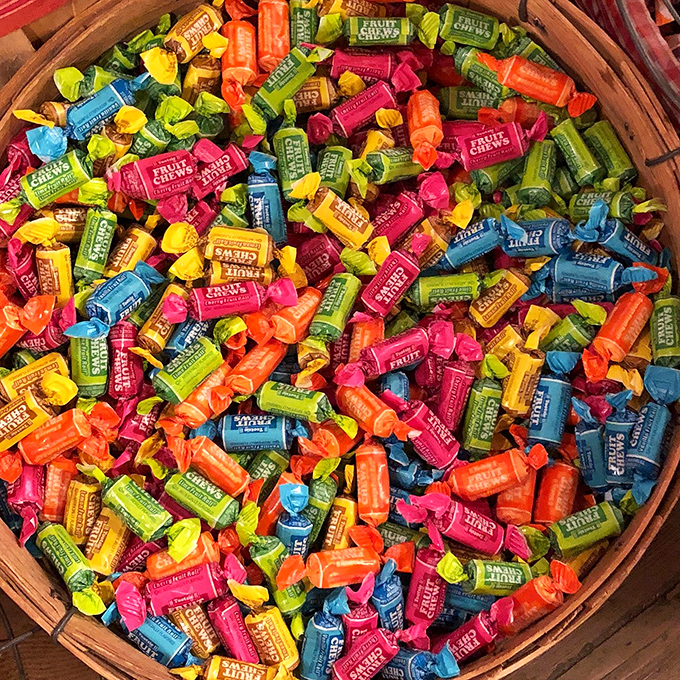 This wooden basket of Fruit Chews isn't just candy&mdash;it's a kaleidoscope of flavor wrapped in wax paper, each twist promising a momentary escape from adulthood.