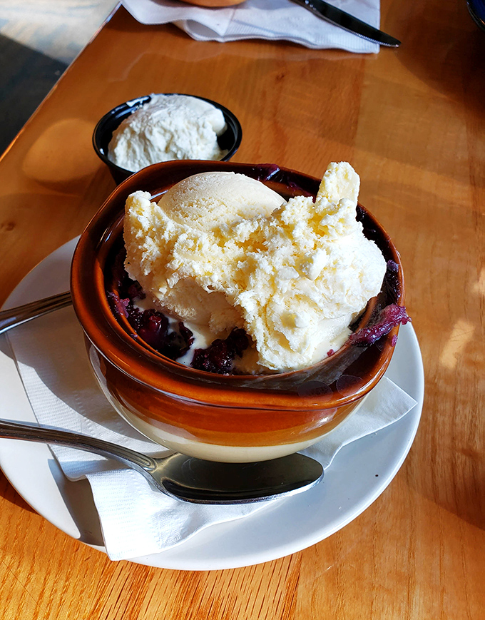 The triple berry cobbler doesn't just end your meal&mdash;it provides the kind of warm, fruity closure therapists should prescribe for anxiety.