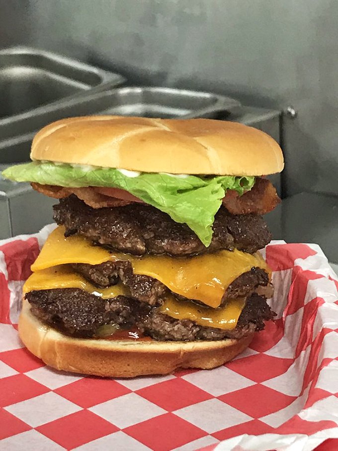 The Triple isn't just a burger—it's a monument to American excess that somehow remains perfectly balanced and utterly irresistible.