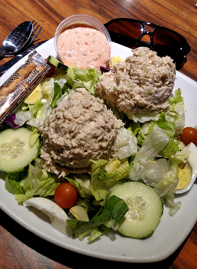 Garden-fresh tuna salad served atop crisp lettuce with a side of thousand island dressing &ndash; proof that "diet food" doesn't have to taste like punishment.