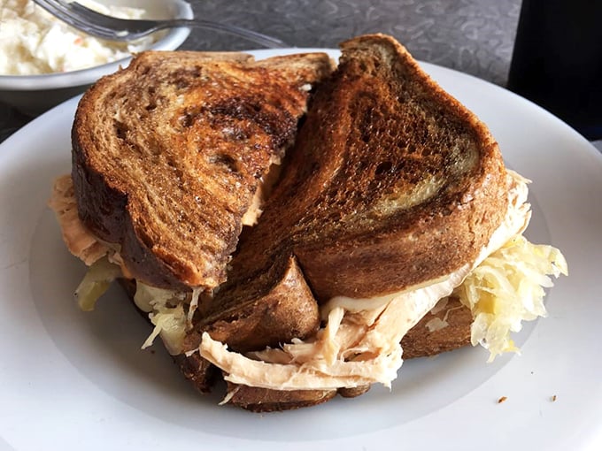 A turkey Reuben with perfect grill marks that say, "Yes, we've been doing this long enough to know exactly what we're doing."