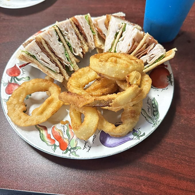 A club sandwich that's stacked higher than Florida's summer humidity levels, with crispy onion rings that make a perfect edible bracelet. If you're feeling fancy.