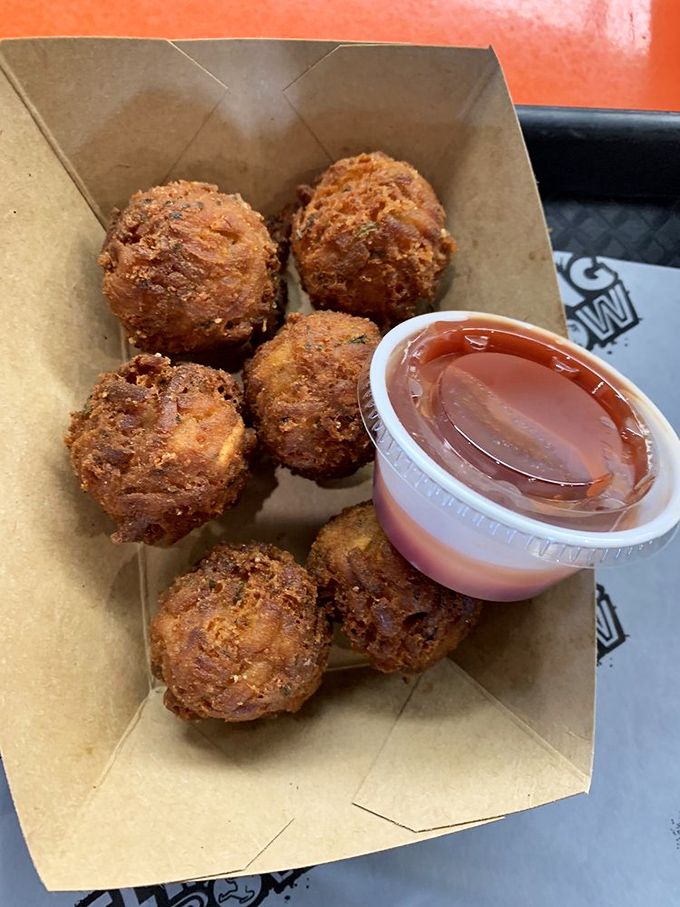 These golden-fried spheres of potato perfection aren't just tots—they're little flavor bombs waiting to detonate in a spectacular display of crispy-meets-creamy magic.