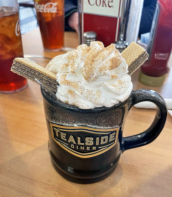 Coffee elevated to an art form&mdash;whipped cream mountain, wafer cookies standing tall, and just enough cinnamon to make your taste buds do a happy dance.