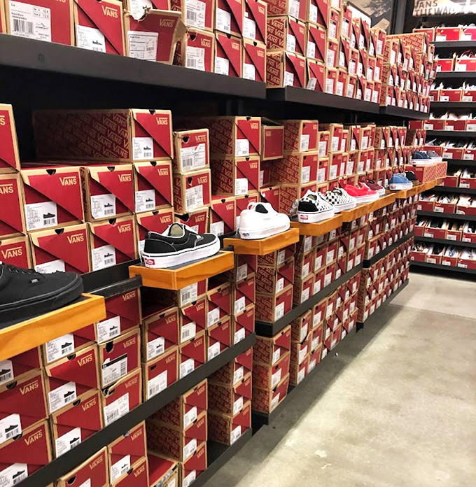 The Vans wall of fame, where classic kicks meet modern prices and your inner skater kid rejoices.