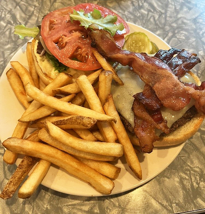 Not just a burger, but a commitment to excellence. Those golden fries standing at attention like they know they're part of something special.