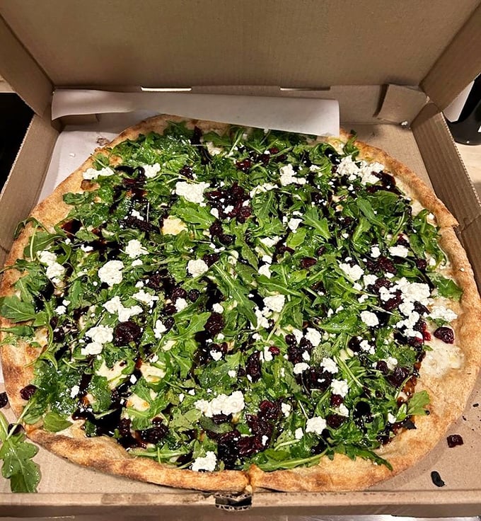 A garden party on a pizza crust. The arugula and goat cheese are having such a good time, they invited cranberries to join the celebration.