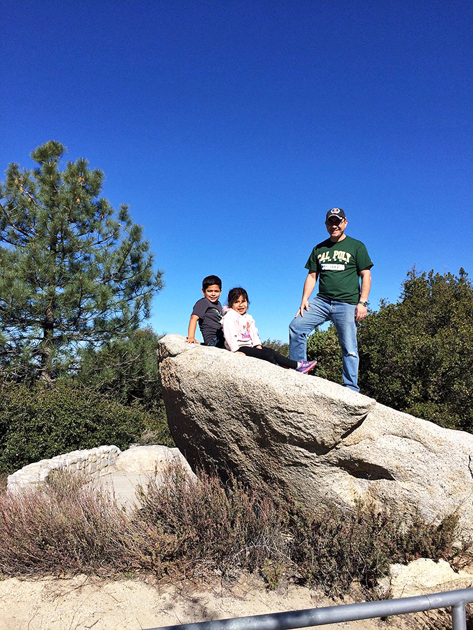 Family memories take shape against nature's backdrop. These rocks have witnessed countless smiles, and they're still not tired of the view.
