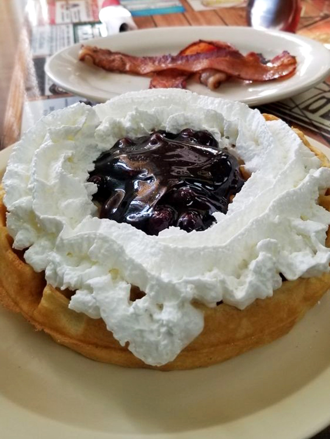 This waffle wears its blueberry topping and whipped cream crown with the confidence of breakfast royalty.