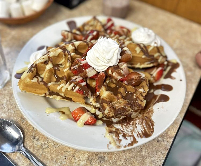 Waffles that have clearly gone to dessert heaven, topped with enough fruit to count as a balanced breakfast. At least that's what I'm telling myself.
