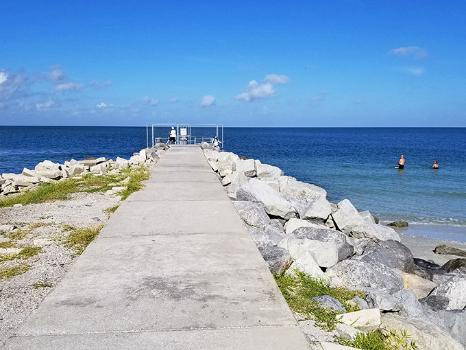 The jetty stretches toward the horizon like a runway to heaven, inviting adventurous souls to walk its length.