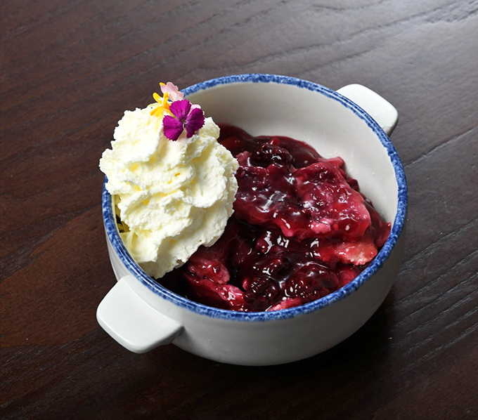 Warm blackberry cobbler that tastes like summer in Kentucky decided to cuddle up with vanilla ice cream and live happily ever after.