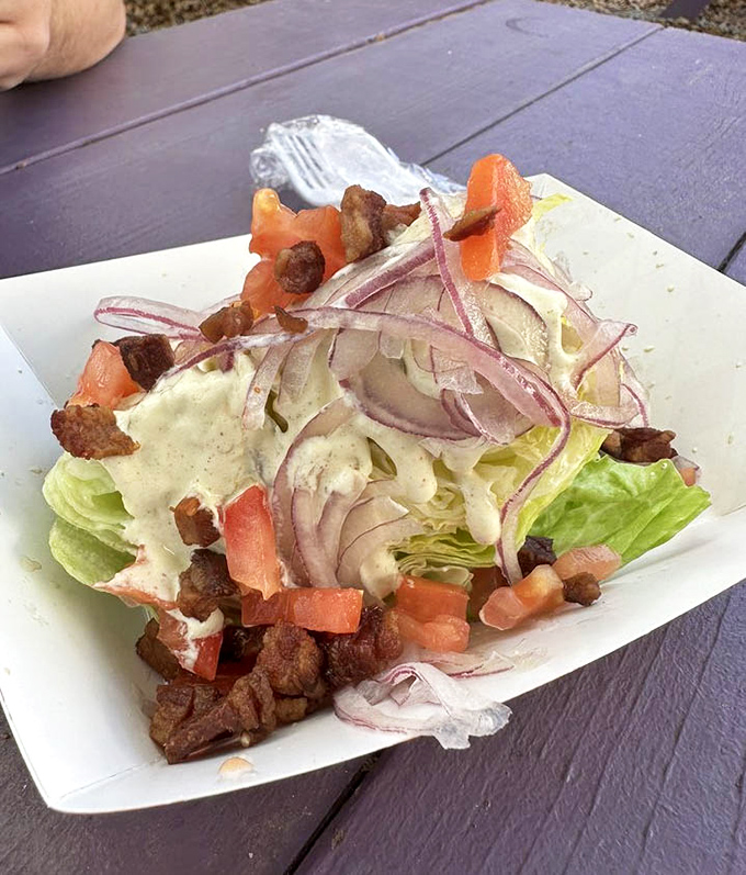 A wedge salad that doesn't apologize for being delicious. Those bacon bits aren't just toppings&mdash;they're little flavor ambassadors doing important work.