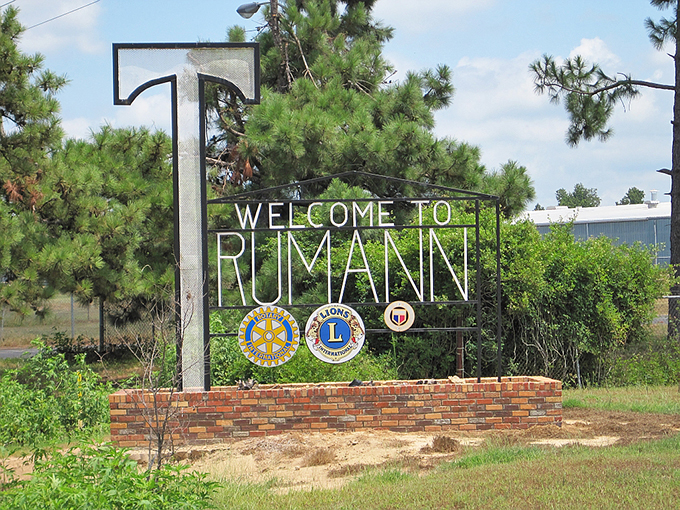 The "T" welcomes you to Trumann with civic pride &ndash; where Rotary and Lions Club emblems signal the community spirit that keeps small towns thriving.