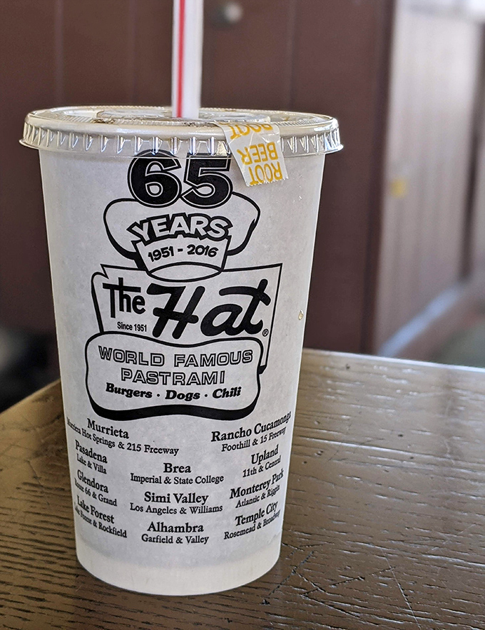 Nothing washes down pastrami perfection like an ice-cold beverage in The Hat's iconic cup. Seventy years of tradition in every sip.