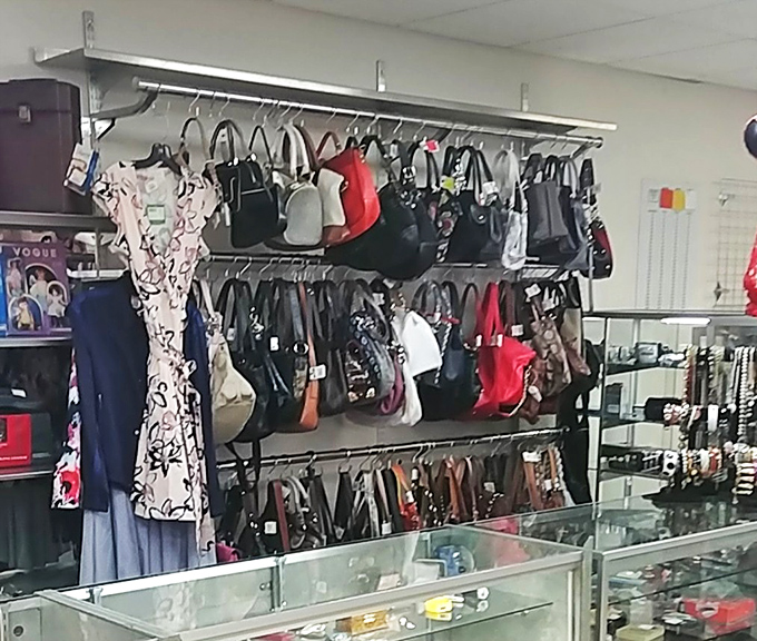 Handbags hang like ripened fruit, designer names occasionally hiding among the everyday options &ndash; the thrill of the hunt personified.