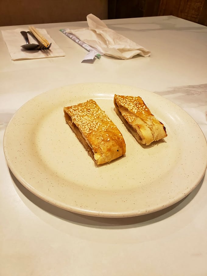 Golden-brown pastries with sesame seeds that look like they just graduated from pastry school with honors. Simple pleasures, perfectly executed.