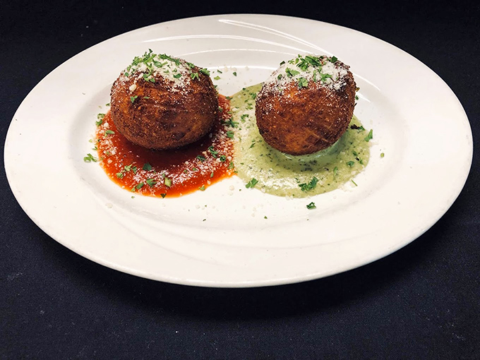 These arancini balls sit like sentinels of satisfaction, guarding their molten cheese centers until that first perfect bite releases their secrets.