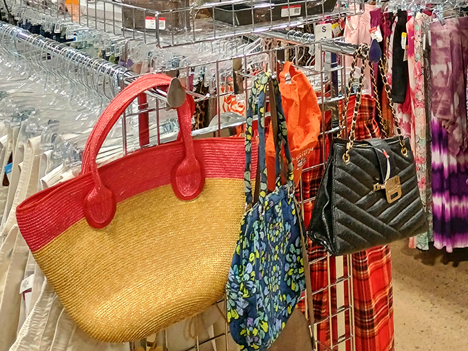 Handbags hanging like colorful fruit, from summery straw totes to quilted evening bags. Yesterday's splurges become today's steals.