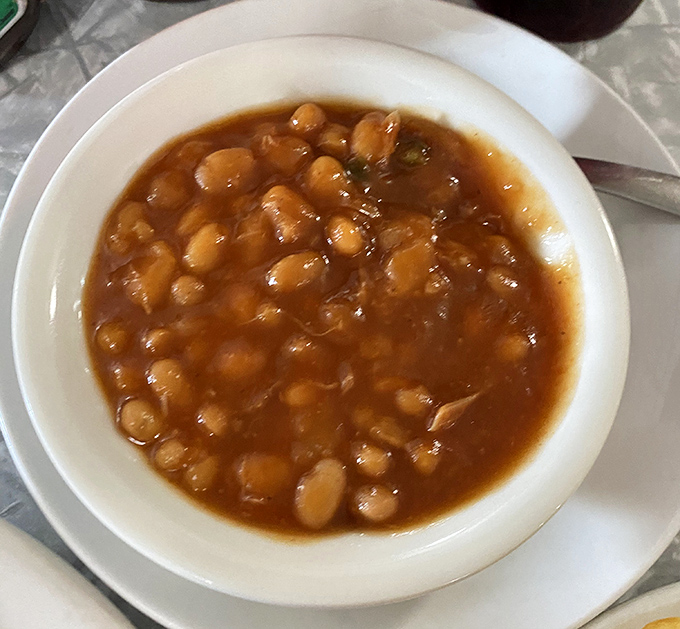 These aren't your sad, straight-from-the-can baked beans. Slow-simmered with barbecue bits and a sweet-savory sauce that demands to be sopped up with bread.