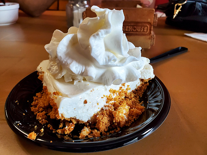 This isn't just banana pudding; it's a towering monument to Southern comfort with clouds of whipped cream that make you forget every diet promise you've ever made.